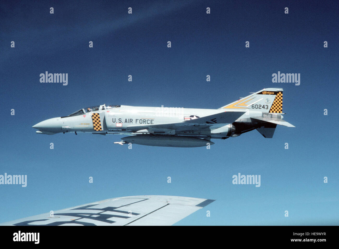 An air-to-air left side view of a Michigan Air National Guard F-4 ...