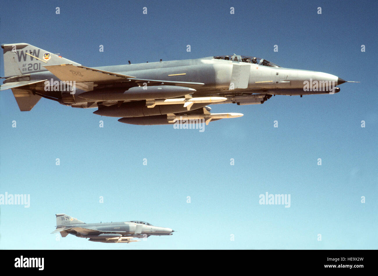 A pair of 35th Tactical Fighter Wing F-4G Phantom II aircraft pass over ...