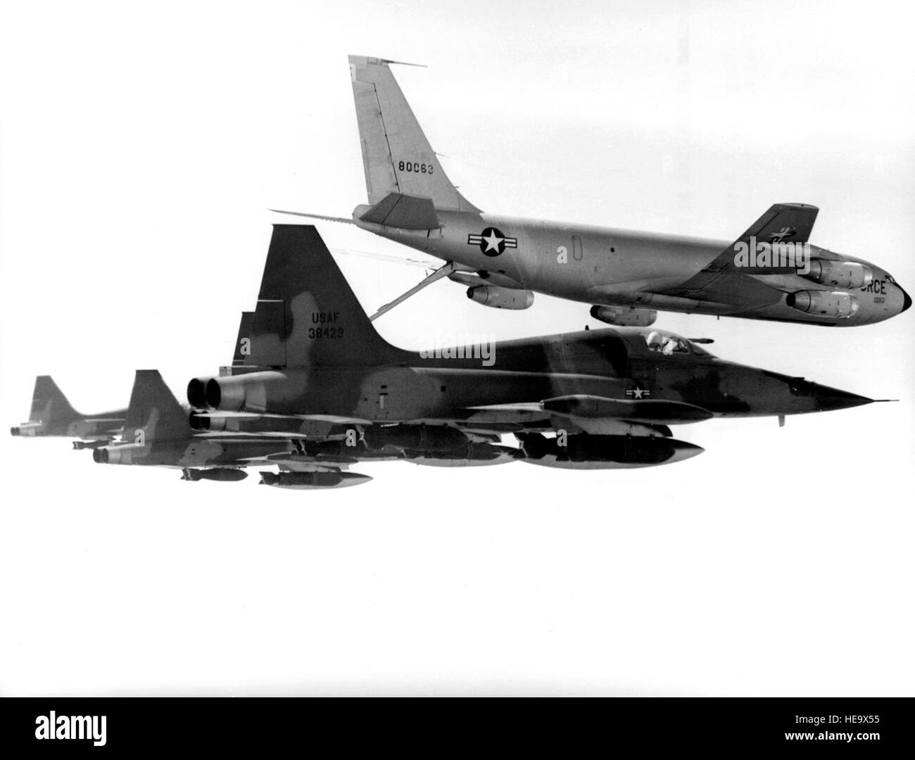 Bomb-laden F-5 Air Force aircraft are shown here refueling from an Air ...
