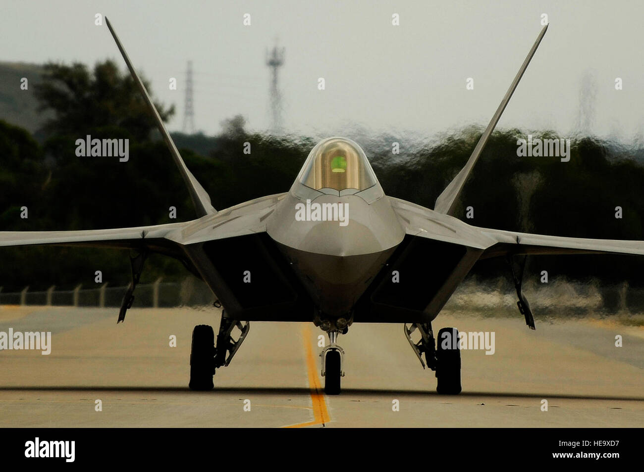 An F-22 Raptor taxies down the ramp for a mission Jan. 14 at Kadena Air ...