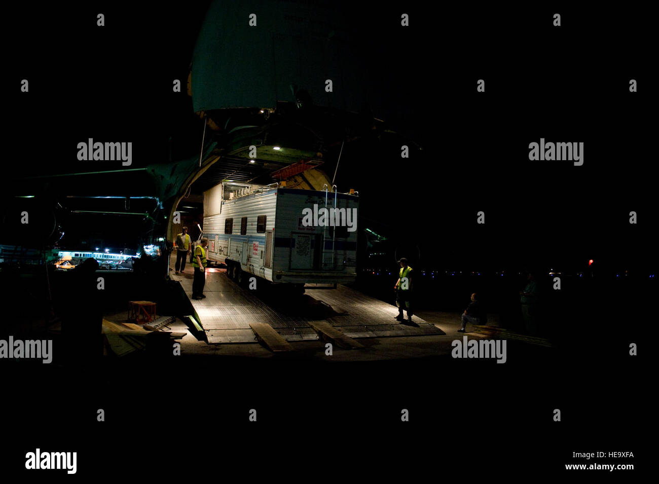 Russian Antonov-124 aircraft loadmasters help unload a Federal Aviation ...