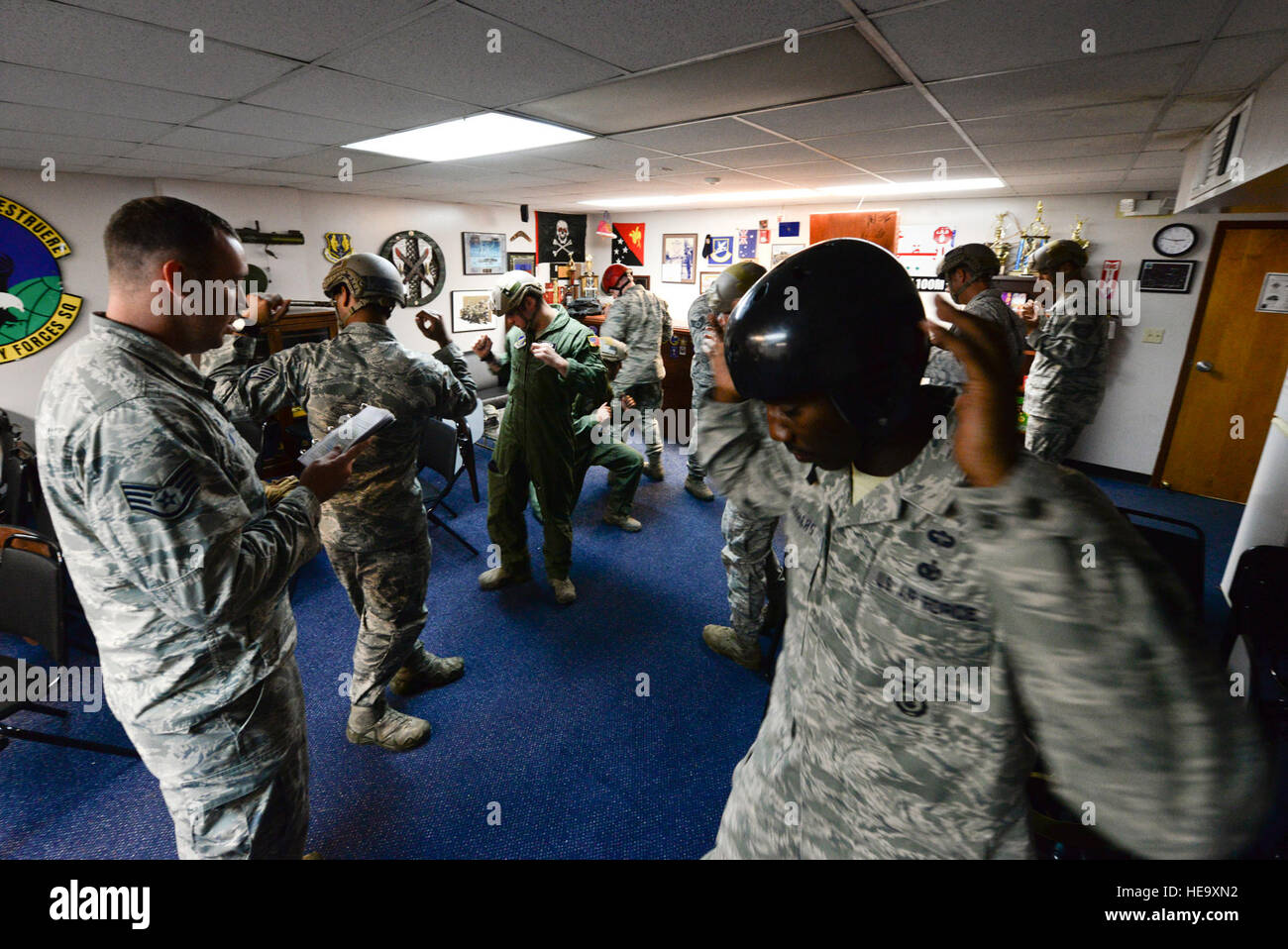 Airmen of the 736th Security Force Squadron review parachuting safety ...
