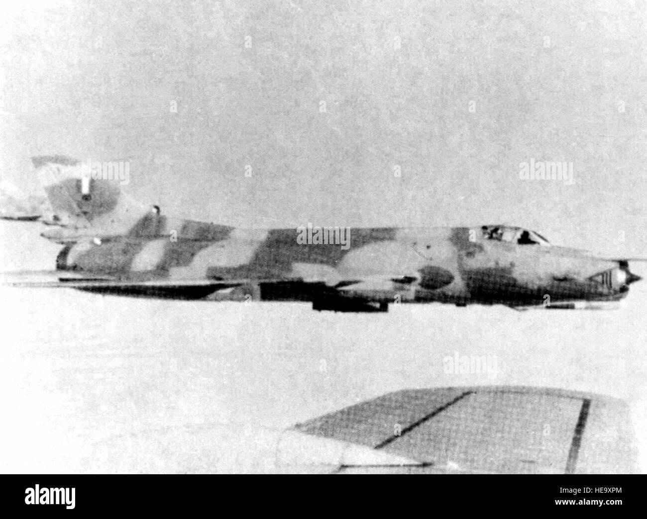 Three Peruvian Air Force Su-7 Fitter-F aircraft are captured in flight ...
