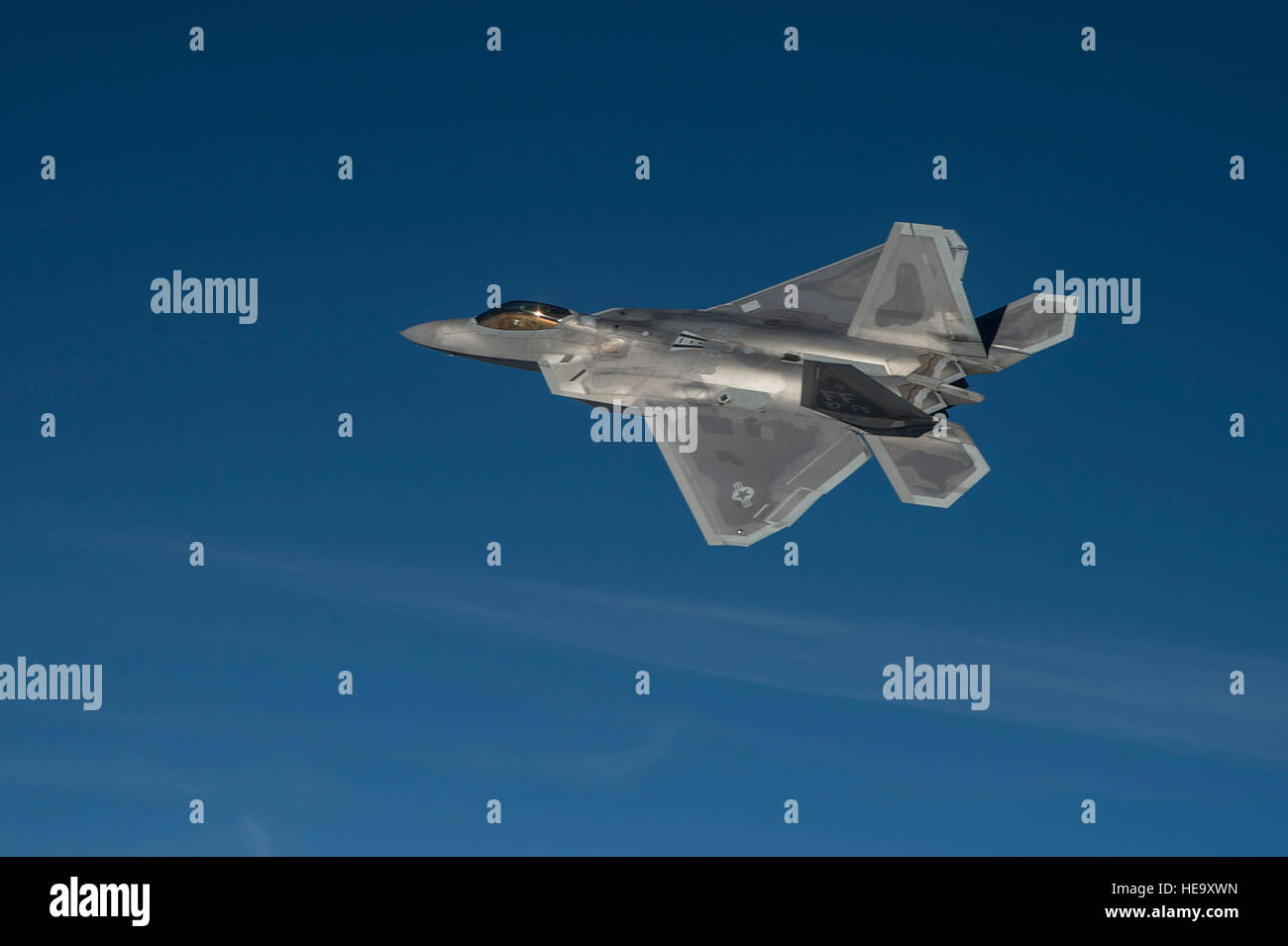 An F-22 Raptor participates in the inaugural Trilateral Exercise at ...