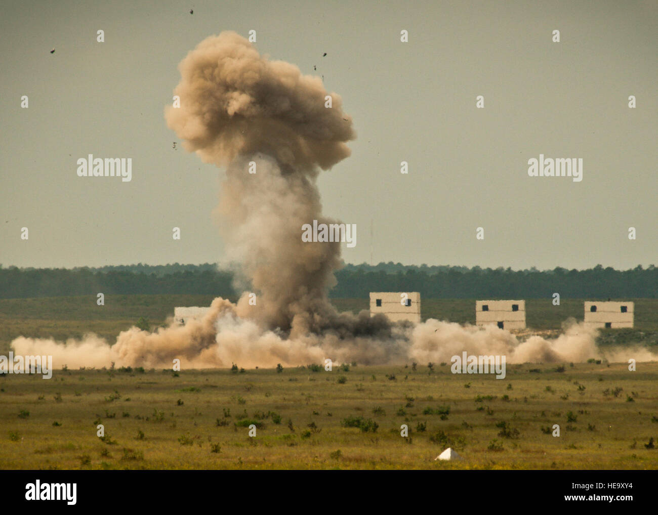 A cloud of heat and smoke erupts from the wreckage after a 1,500 pound ...