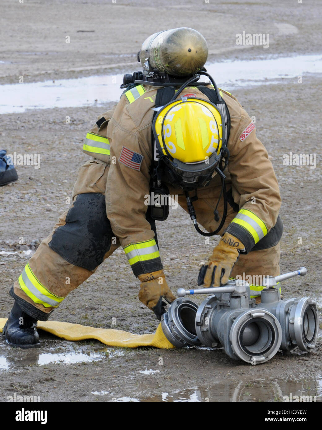 A firefighter with the 100th Civil Engineer Squadron Fire Department ...