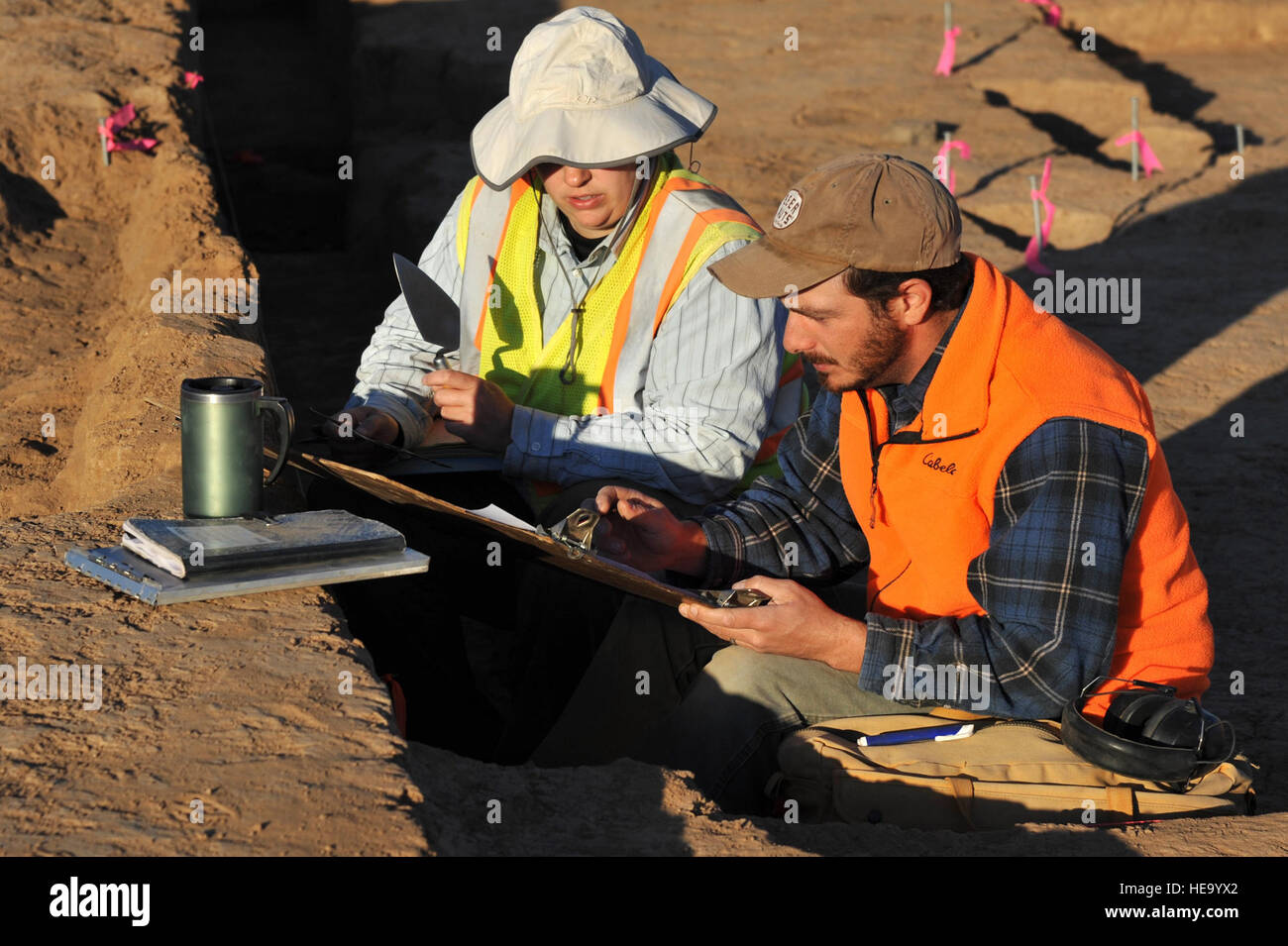 Jeff Charest and Lauren Jelinek, archaeologist field technicians, draw ...
