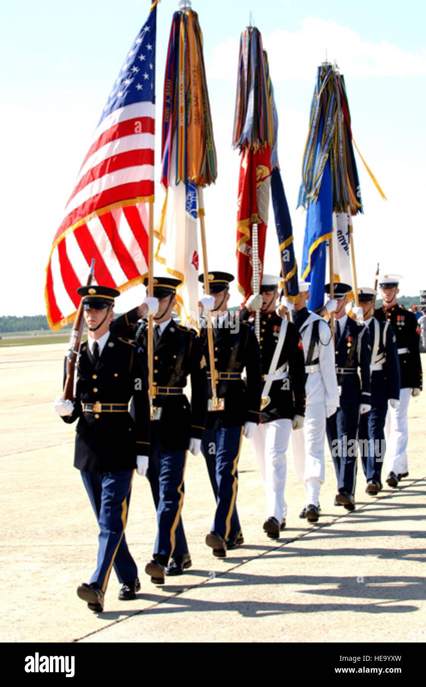 A Joint Service Color Guard post the U.S. and four service flags during ...