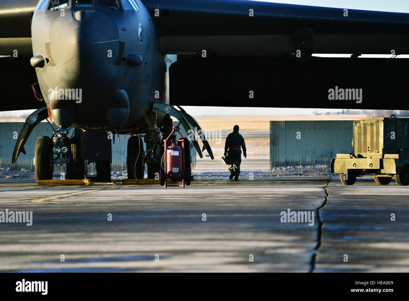 An Airman from the 5th Maintenance Group walks to a B-52H Stratofortress on Minot Air Force Base ...