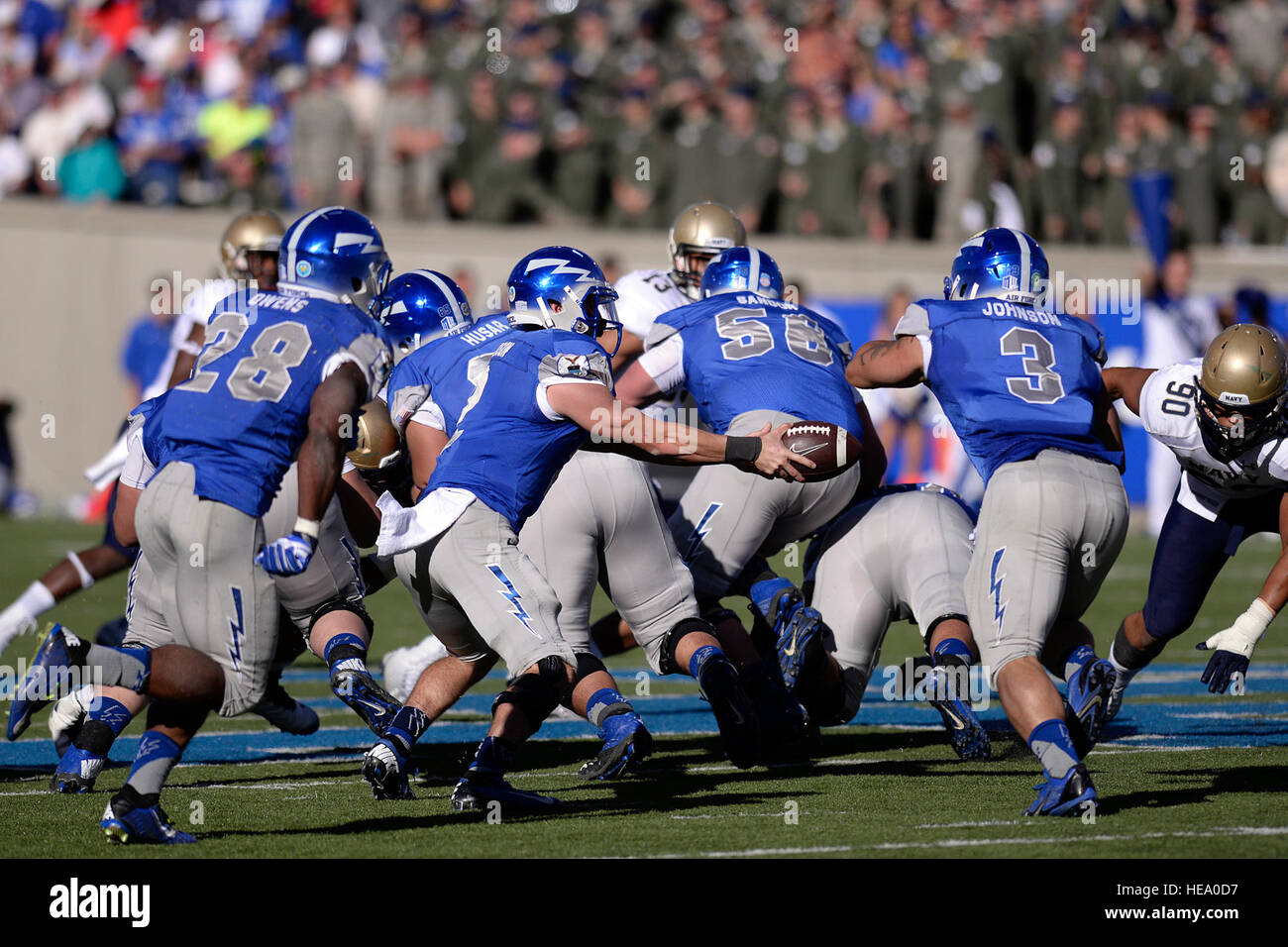 Senior quarterback Kale Pearson hands off as the U.S. Air Force Academy ...