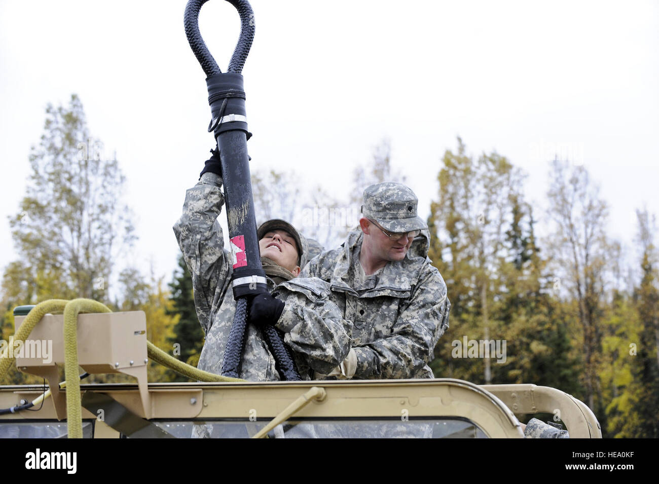 Pfc. Wanda Cox (left), of Sylvester, Ga., rehearses hoisting a cable as ...