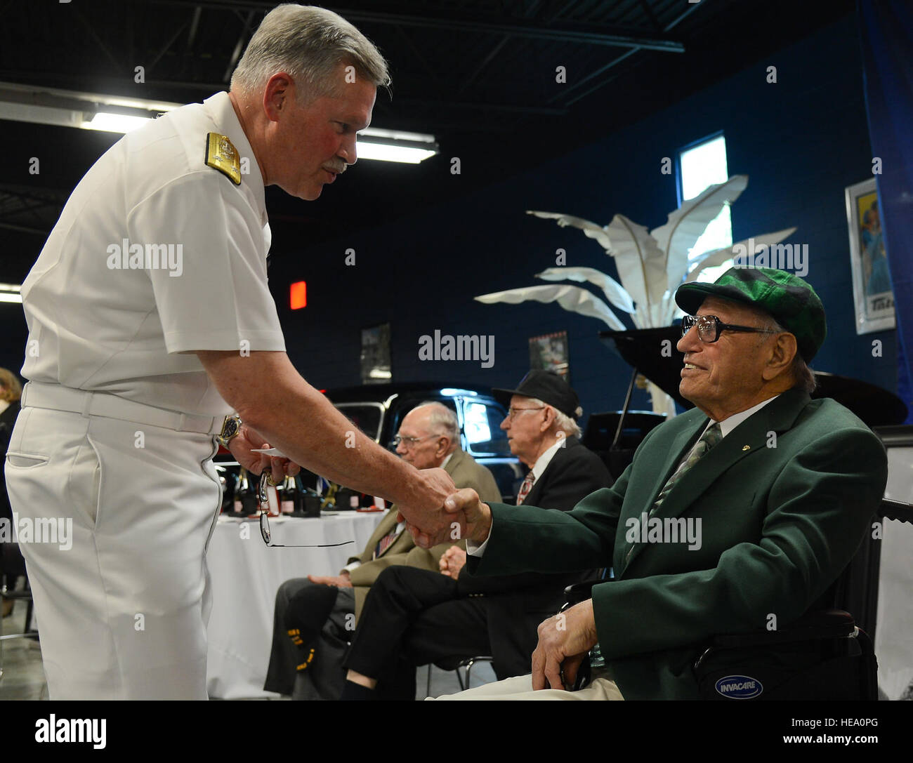 Vice Adm. Mark Fox, U.S. Central Command deputy commander, shakes the ...