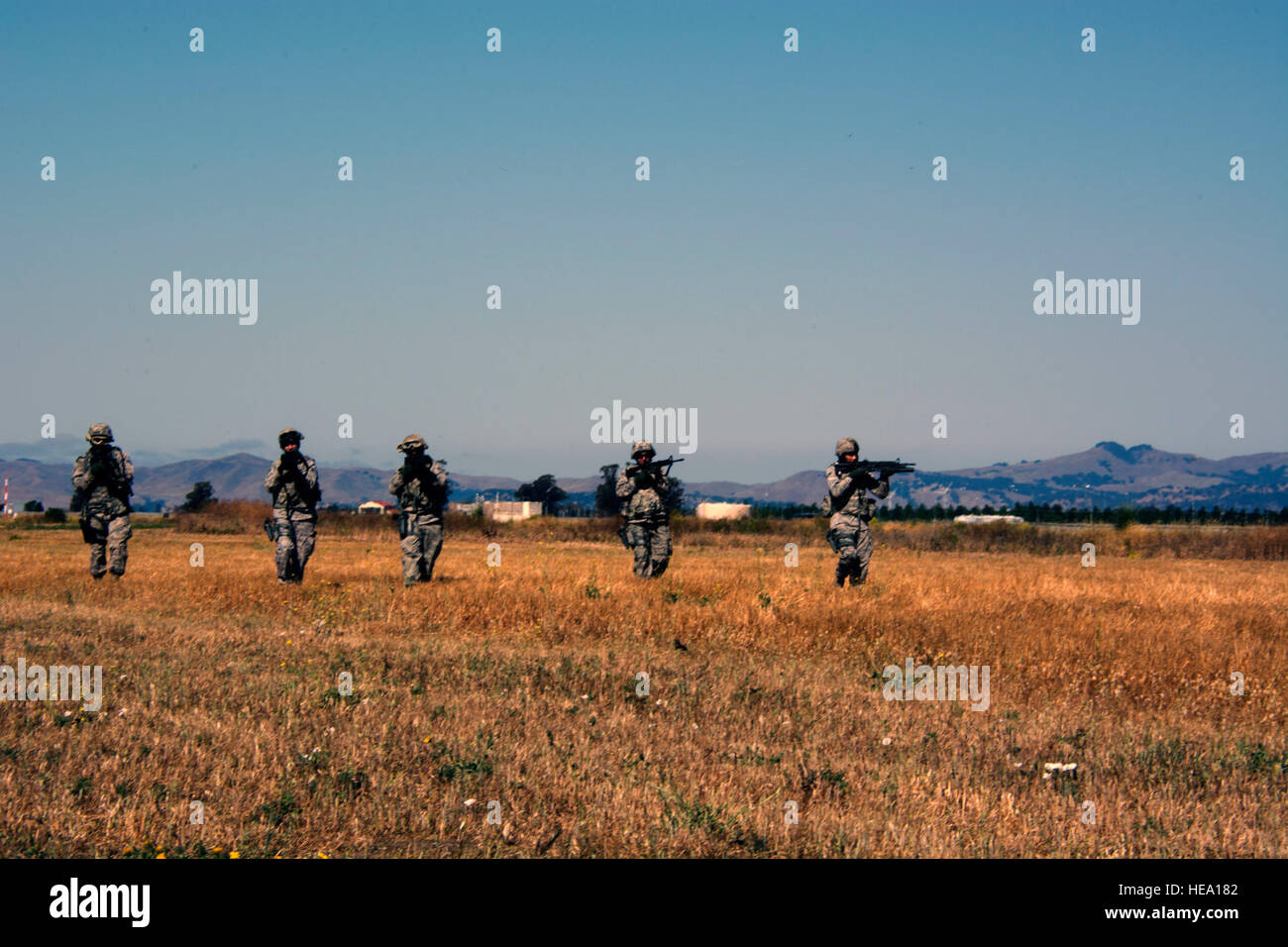 A fire team of defenders from the 349th Security Forces Squadron sweep ...