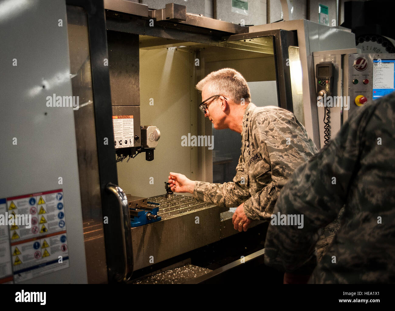 General Paul Selva, Air Mobility Command commander, reaches into a ...