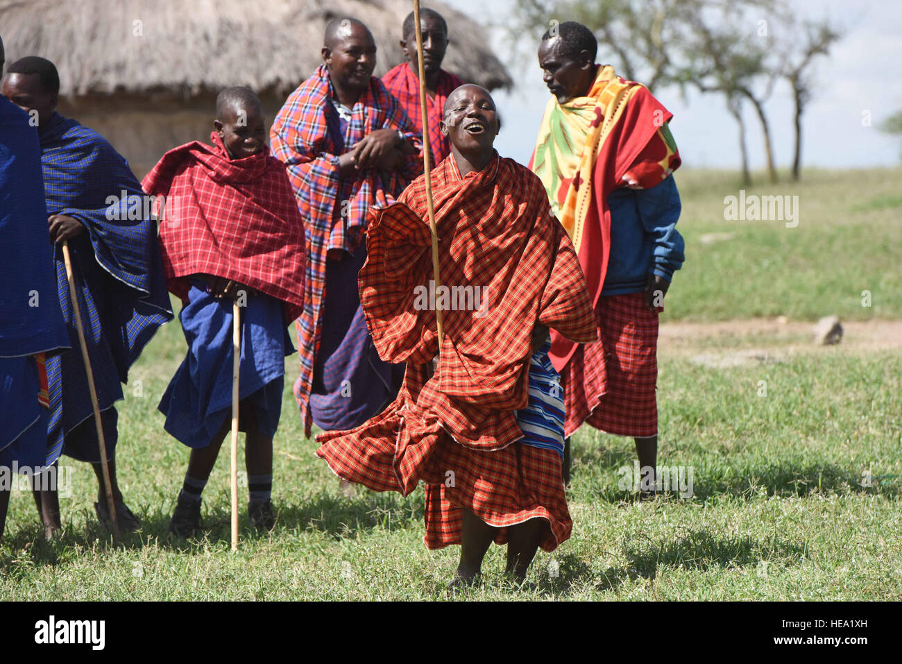 A Massai tribe member dances for the visitors from the Gender ...