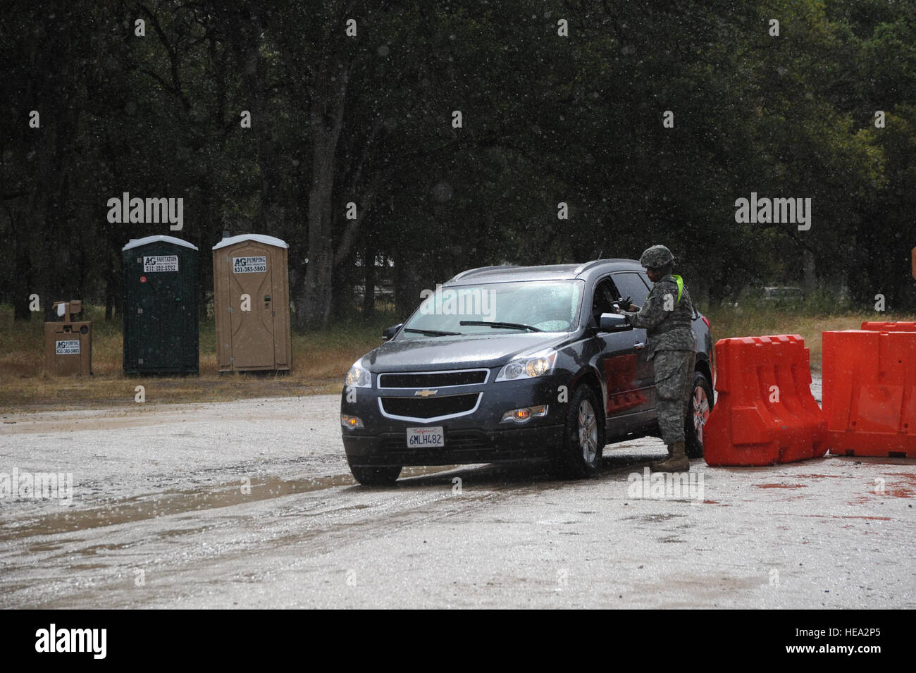 A U.S. Soldier with the 889th MCT Salt Lake City Utah checks a vehicle ...