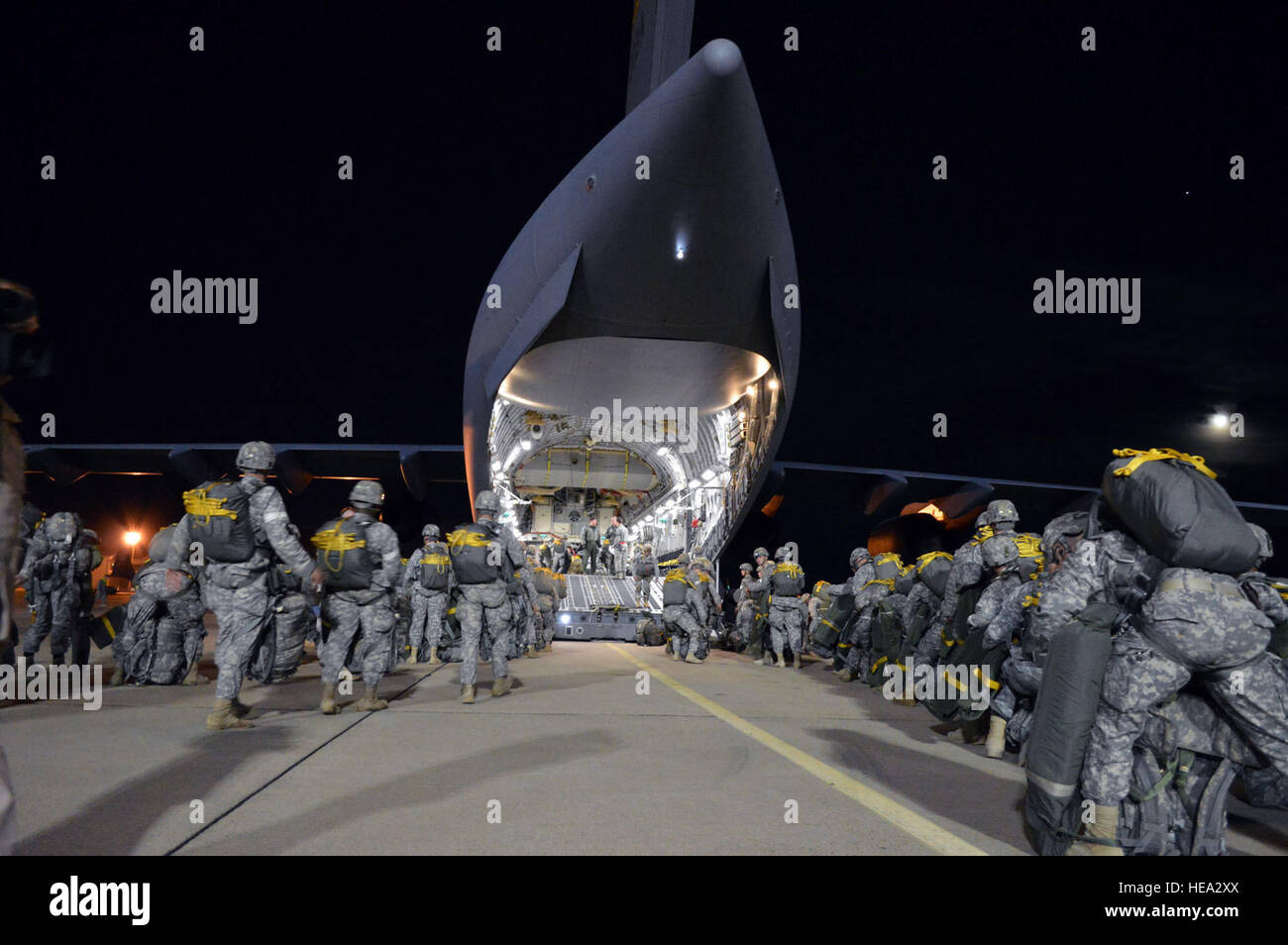 Army paratroopers from the 82nd Airborne Division load onto Air Force C ...