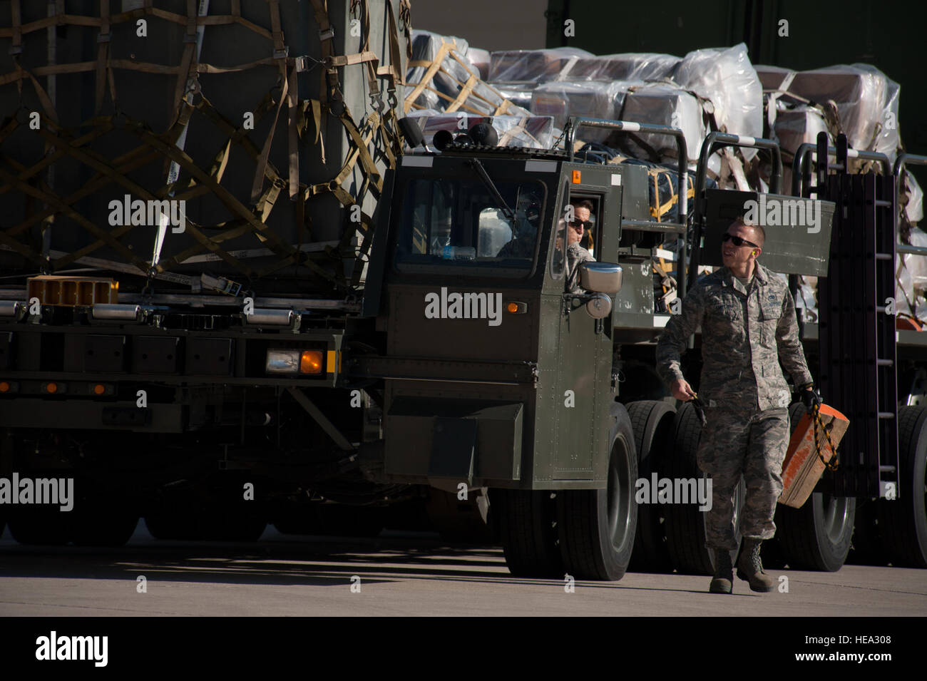 Airmen from the 5th Logistics Readiness Squadron load cargo onto a C ...
