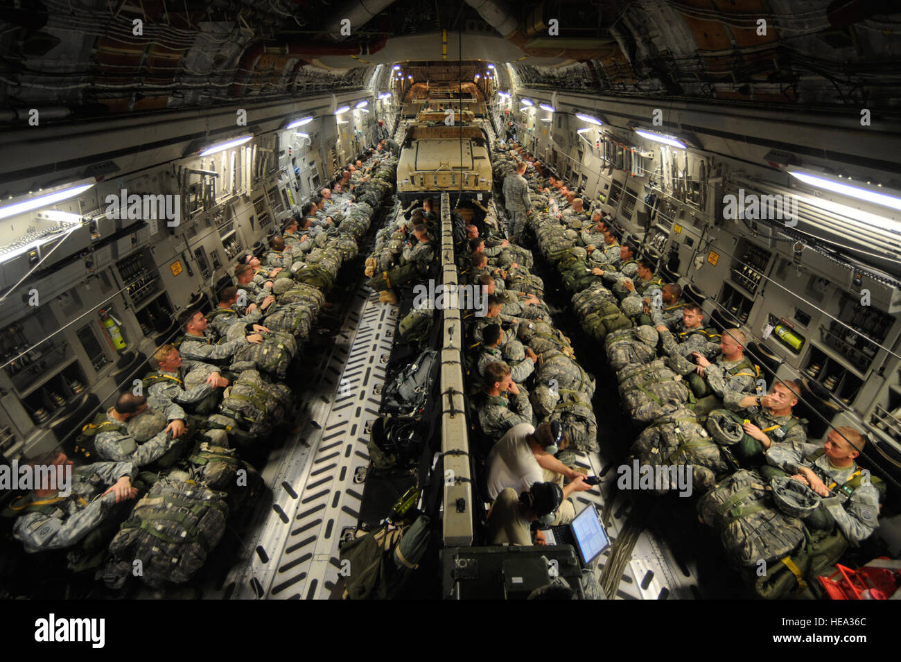 U.S. Soldiers from the 82nd Airborne Division ride in an Air Force C-17 ...