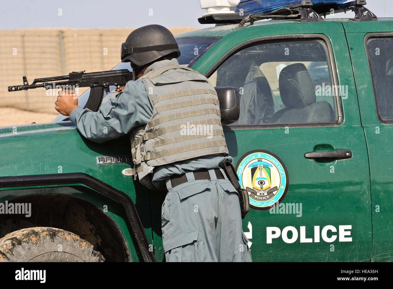 Afghan national policeman demonstrates tactical maneuvers at the ...