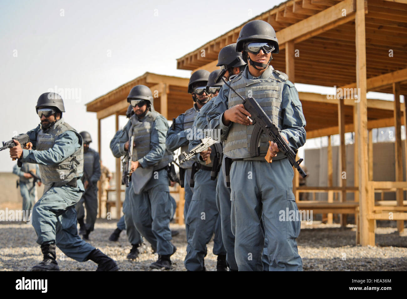 Afghan national policemen demonstrate their tactical maneuvers at the ...