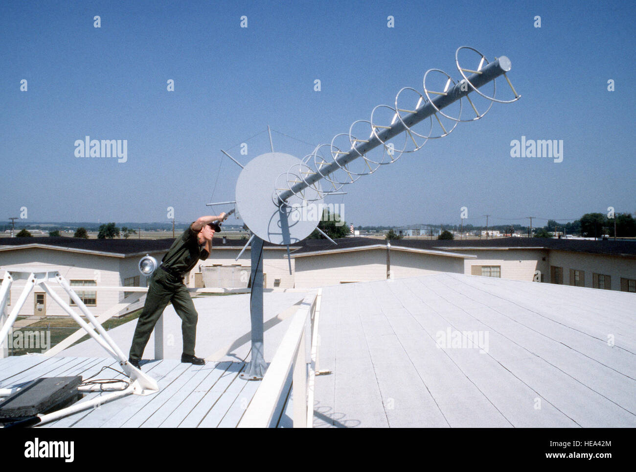 A member of the Air Force Communications Command directs a satellite ...