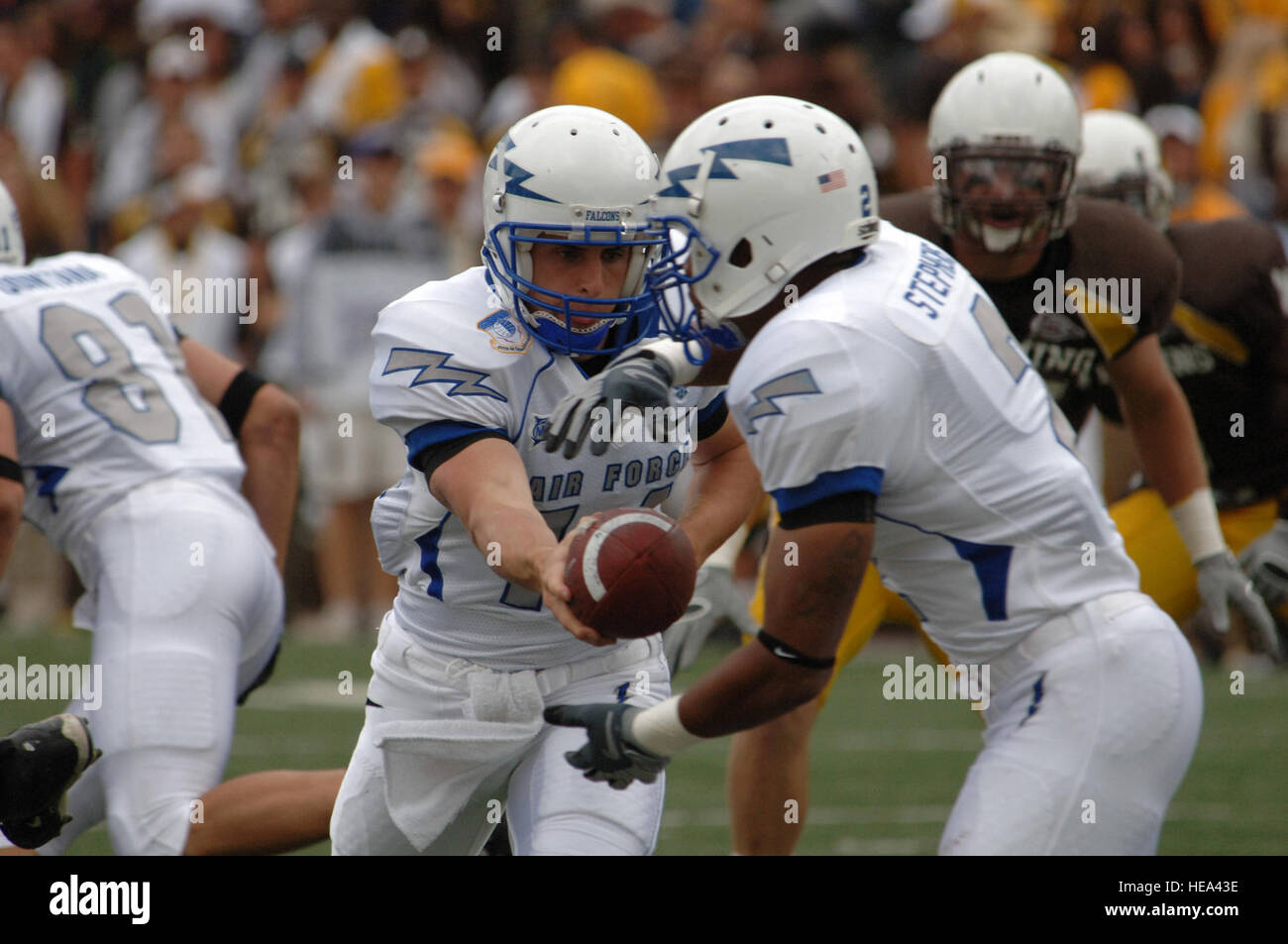 U.S. Air Force Academy quarterback Shea Smith hands off to tailback ...