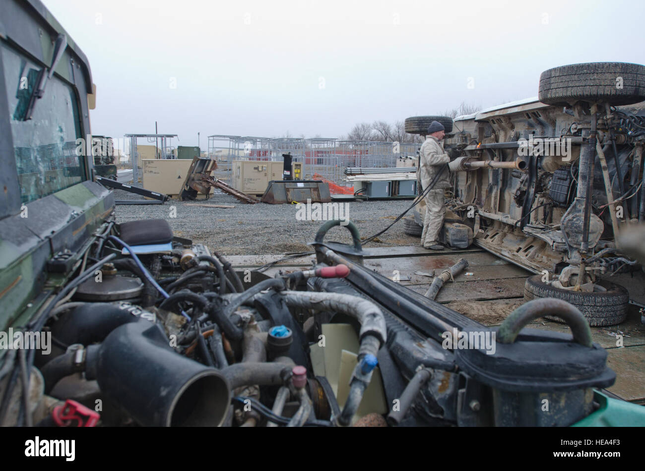 A Humvee sits waiting its turn for destruction as a Kyrgyz contractor ...