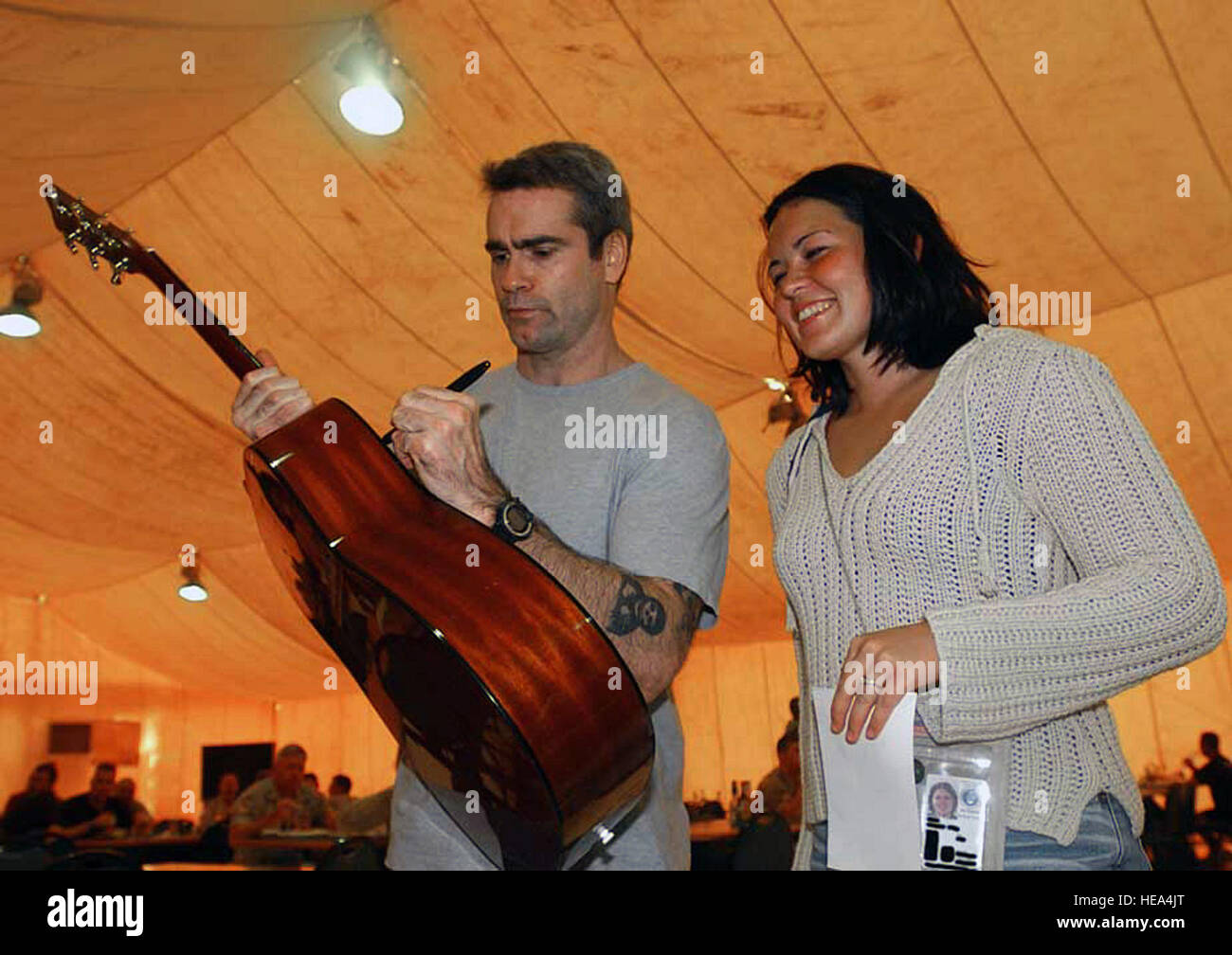 Henry Rollins, Actor and Musician, signs a guitar at a base dining ...