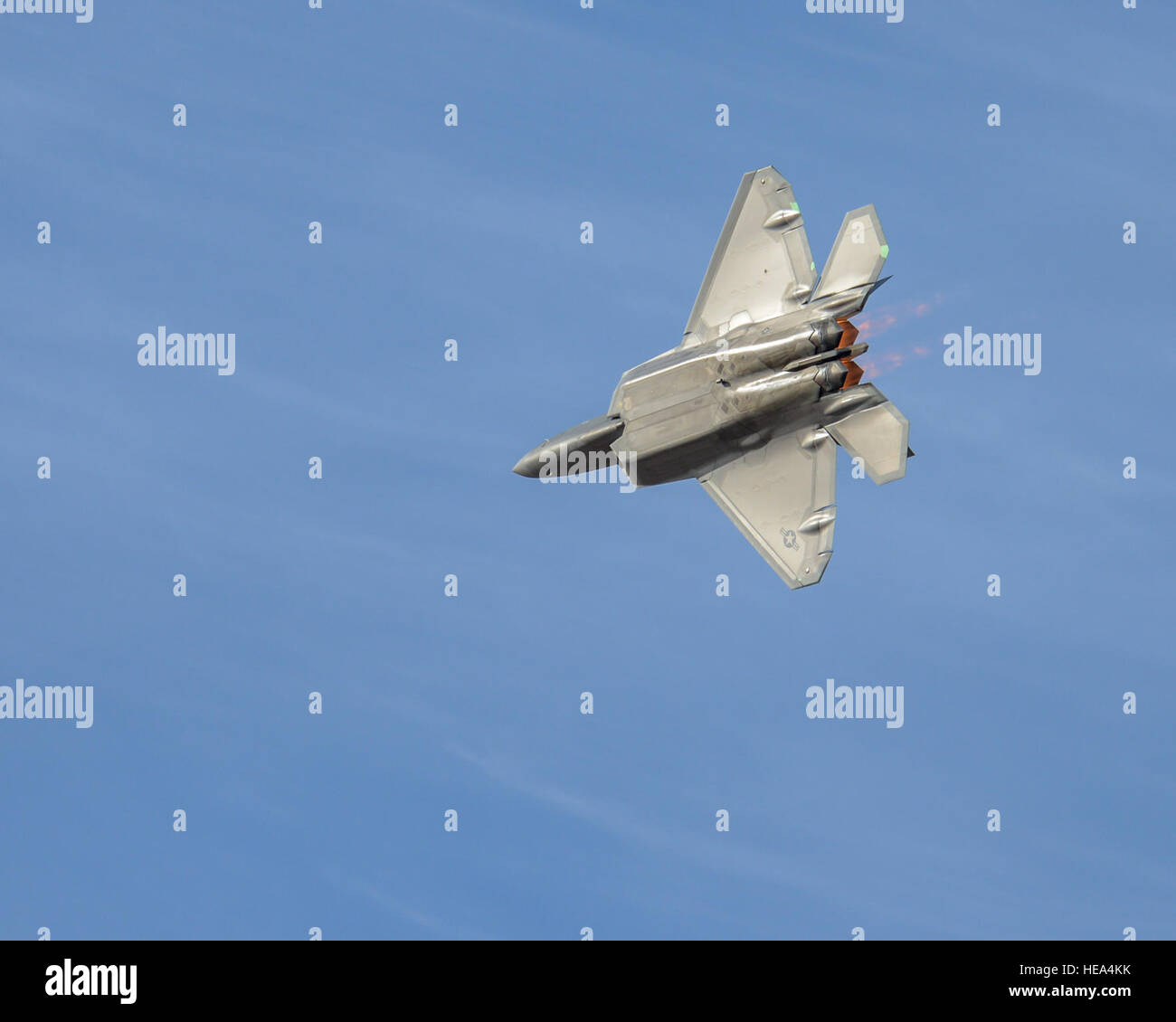 A U.S. Air Force F-22 Raptor performs an aerial maneuver during the ...