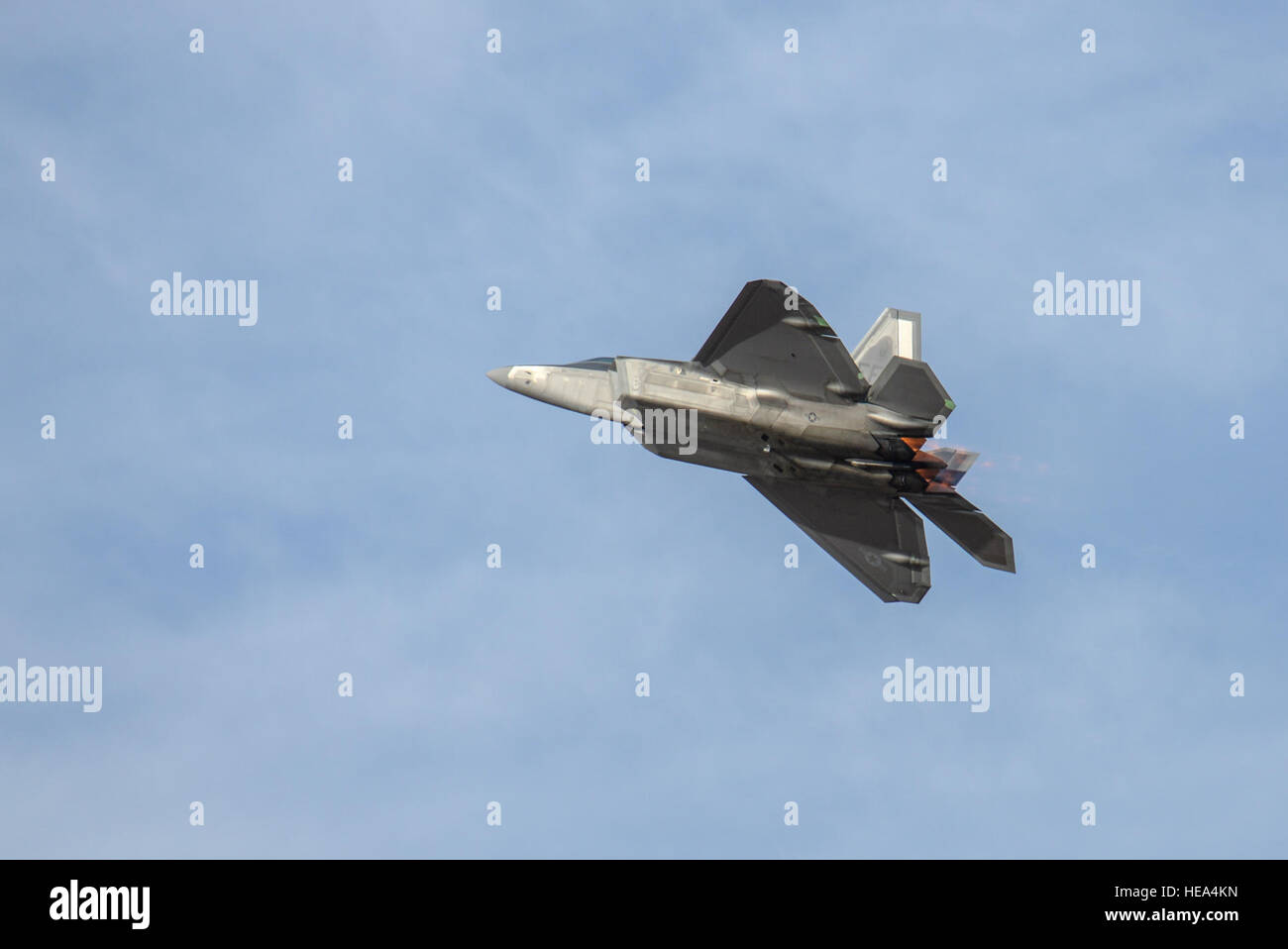 A U.S. Air Force F-22 Raptor performs an aerial maneuver during the ...