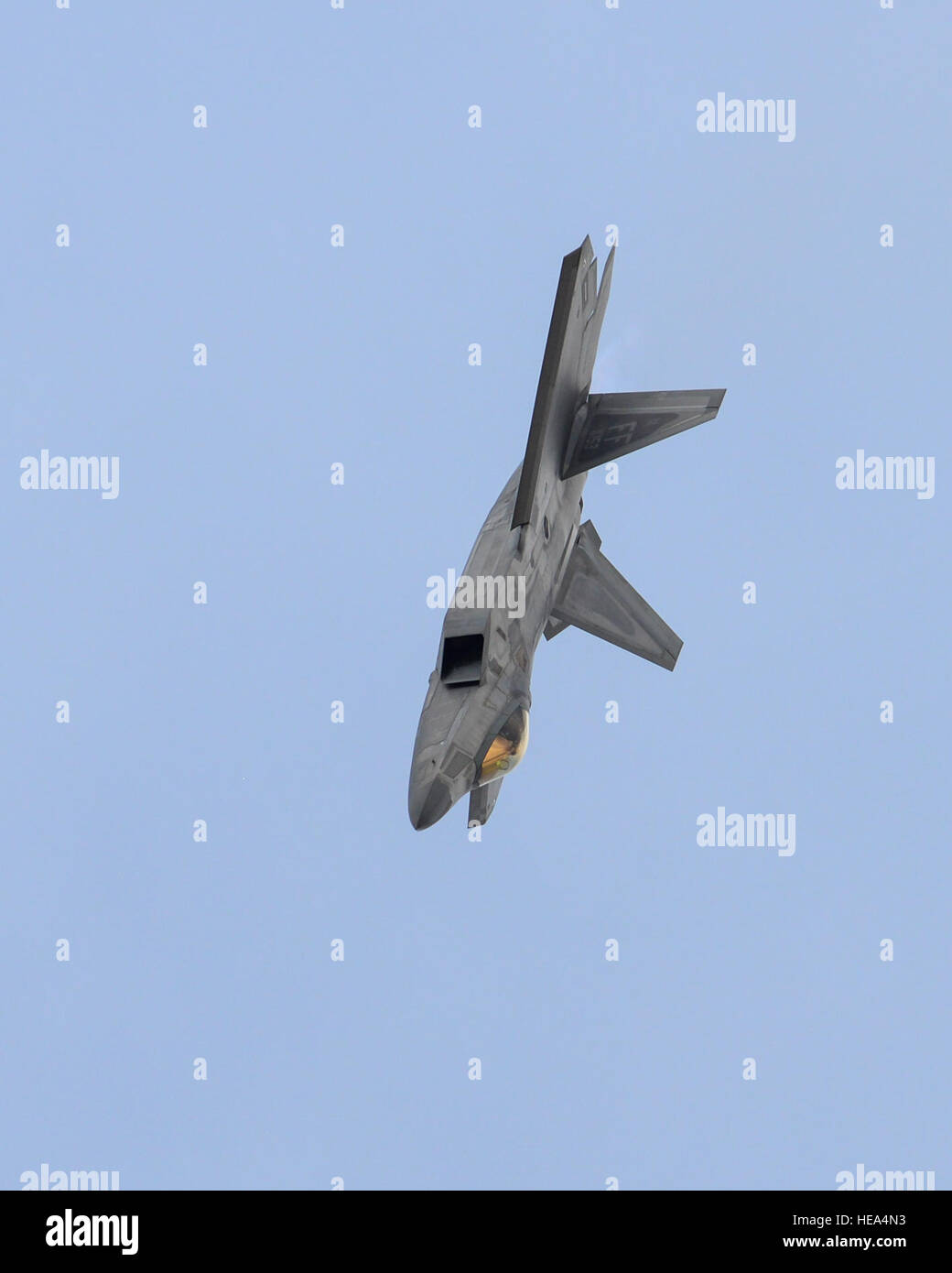 A U.S. Air Force F-22 Raptor performs an aerial maneuver during the ...
