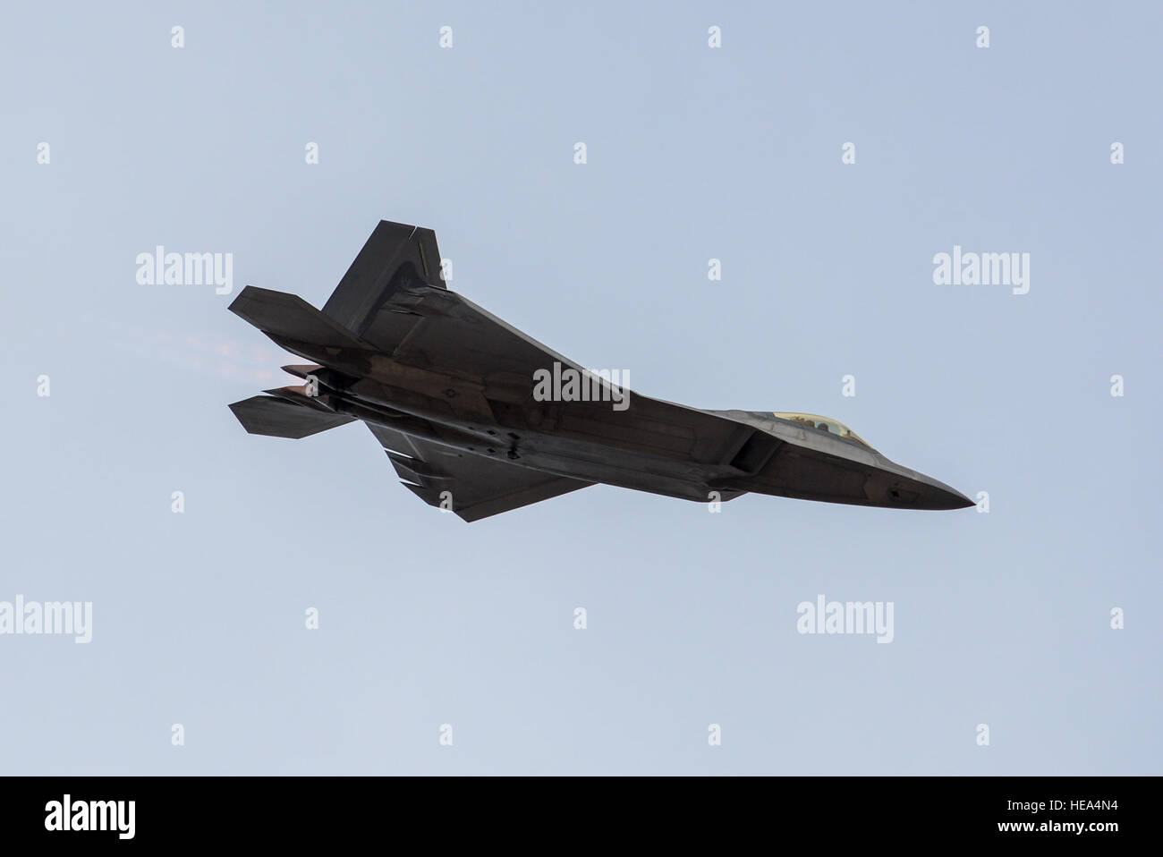 A U.S. Air Force F-22 Raptor performs an aerial maneuver during the ...