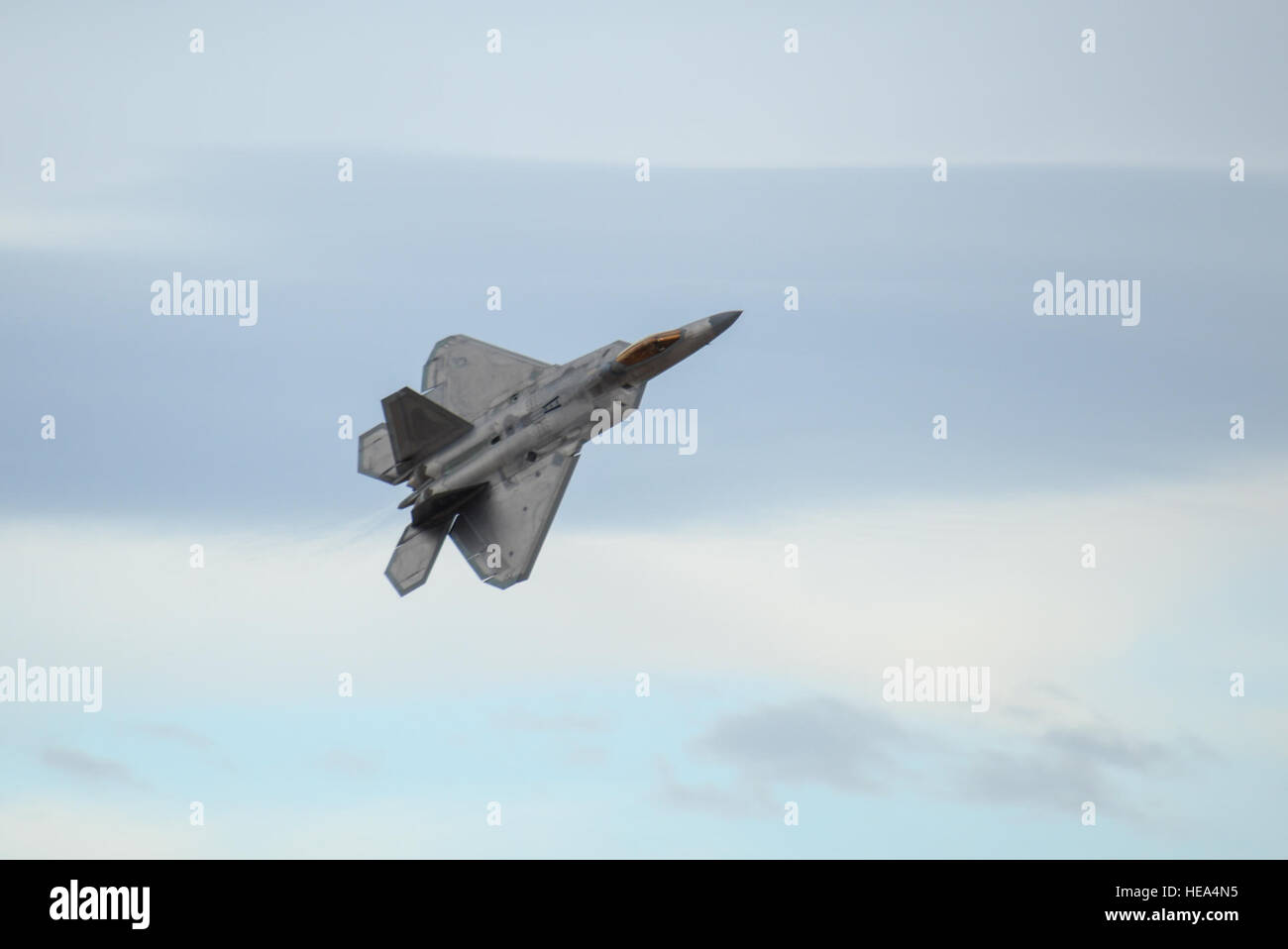 A U.S. Air Force F-22 Raptor performs an aerial maneuver during the ...