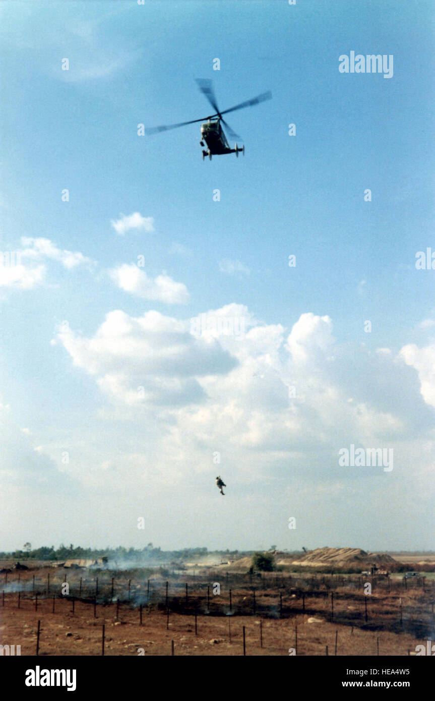 As the Kaman HH-43F Huskie (Pedro) hovers, Airman First Class (A1C ...