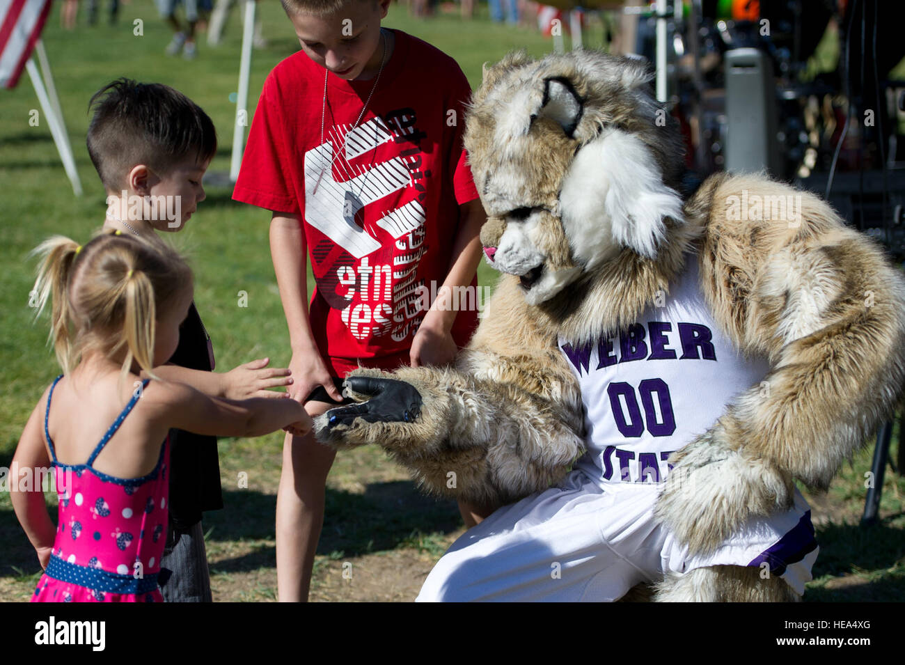 Children greet a Weber State University mascot during the 2013 Salute ...
