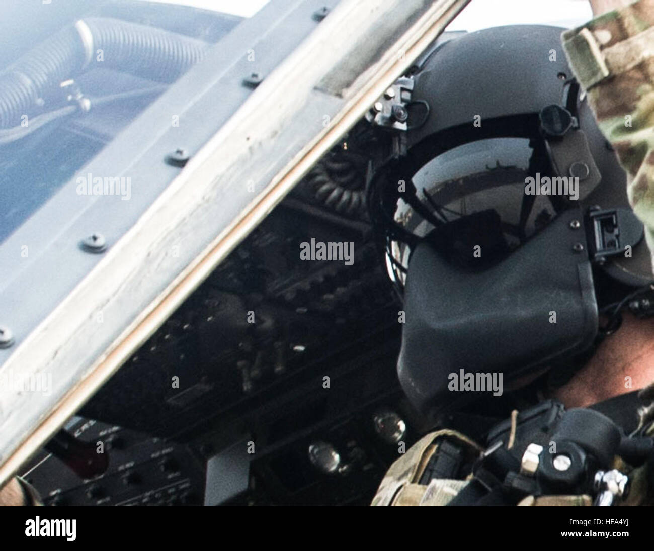 A pilot with the 303rd Expeditionary Rescue Squadron looks out from his ...