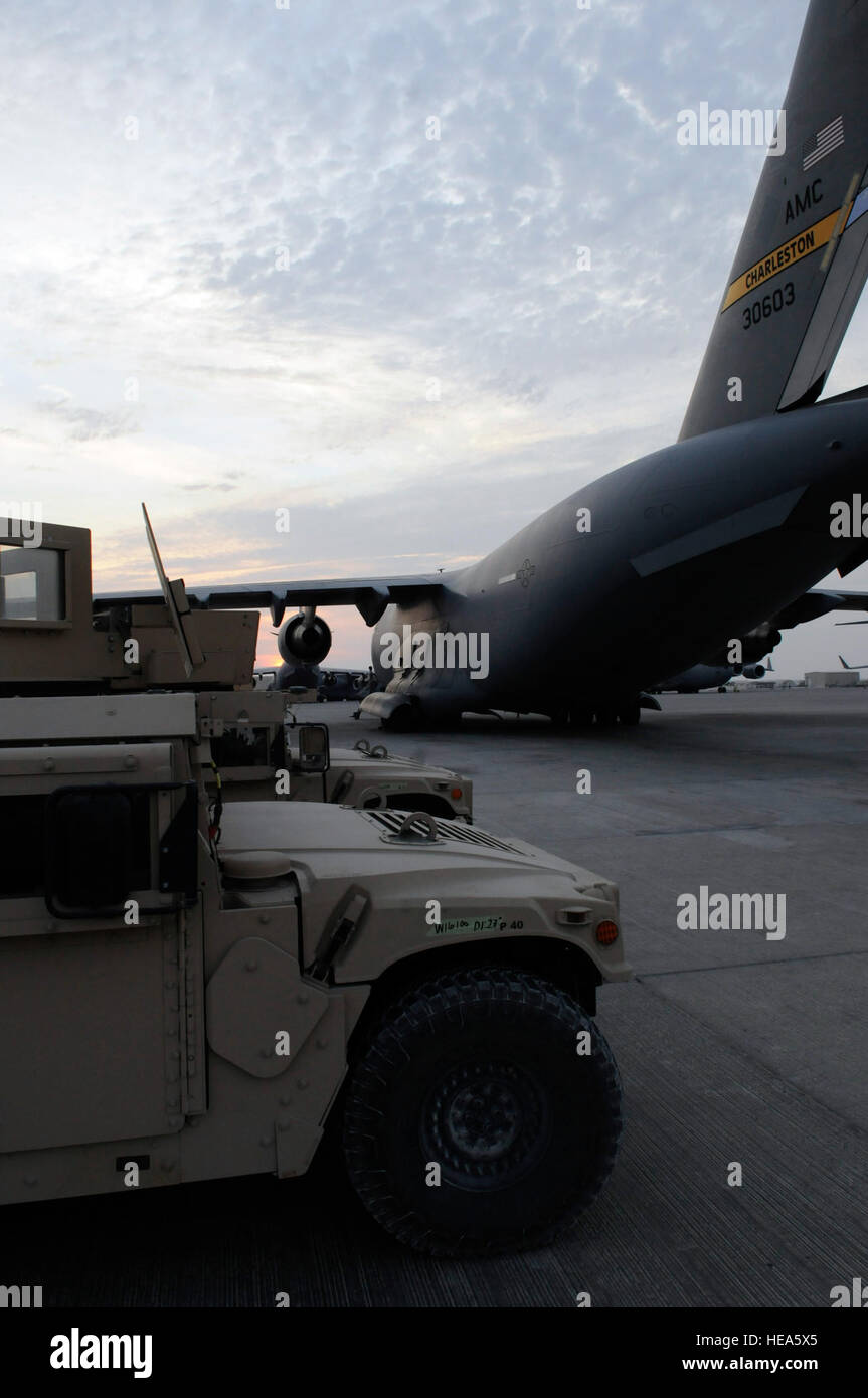 Eight fully armored High Mobility Multipurpose Wheeled Vehicles are ...