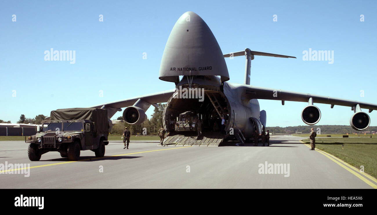 ALBANY, N.Y. -- A scamp crane sits inside a C-5 Galaxy before a Humvee ...