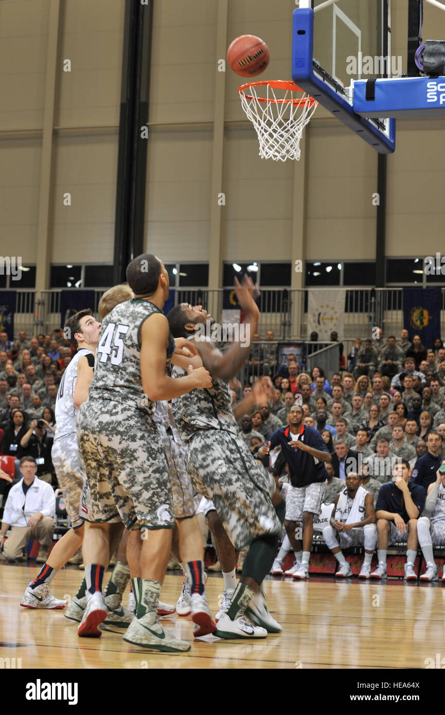 Team members from Michigan State and the University of Connecticut wait ...
