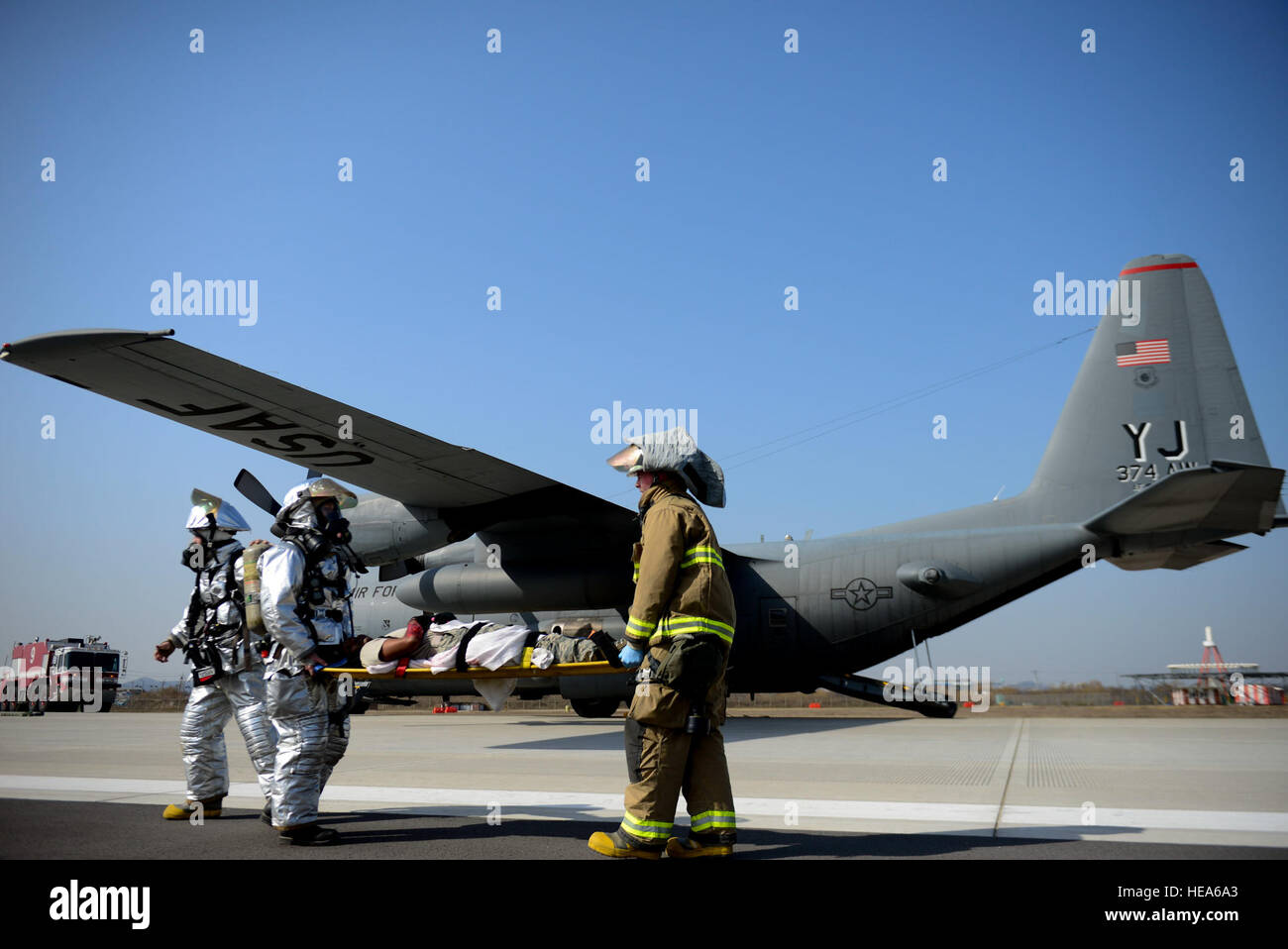 Firefighters from the 51st Civil Engineer Squadron transport a ...