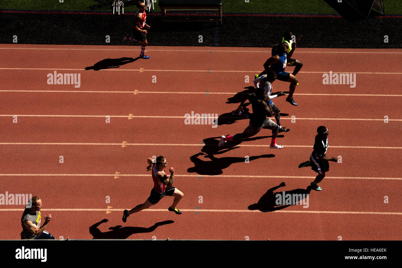 Athletes from the Department of Defense run the 100 meter dash during ...