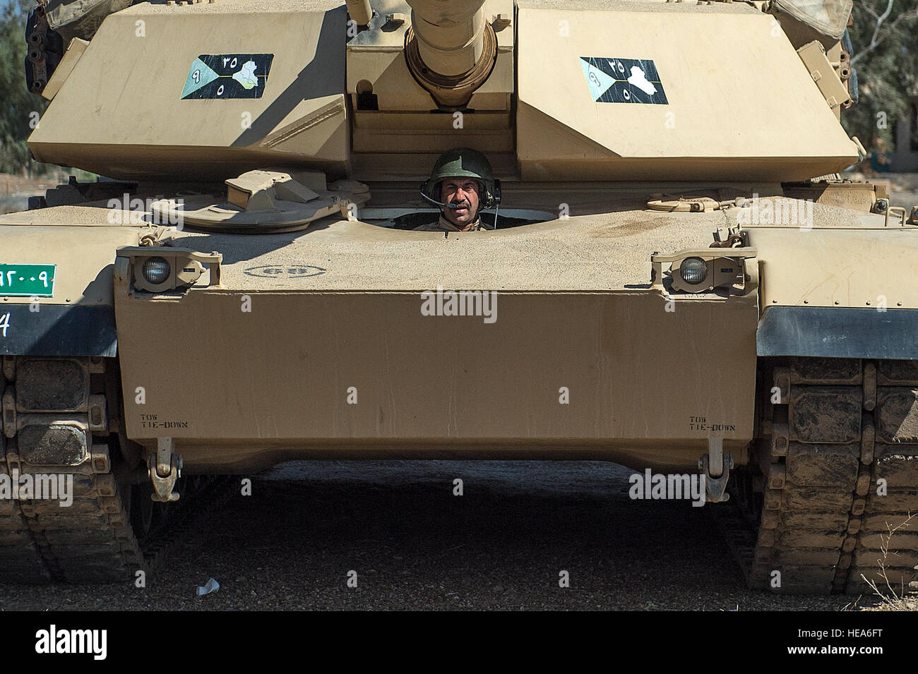 An Iraqi army tank commander drives an M1 Abrams battle tank during ...