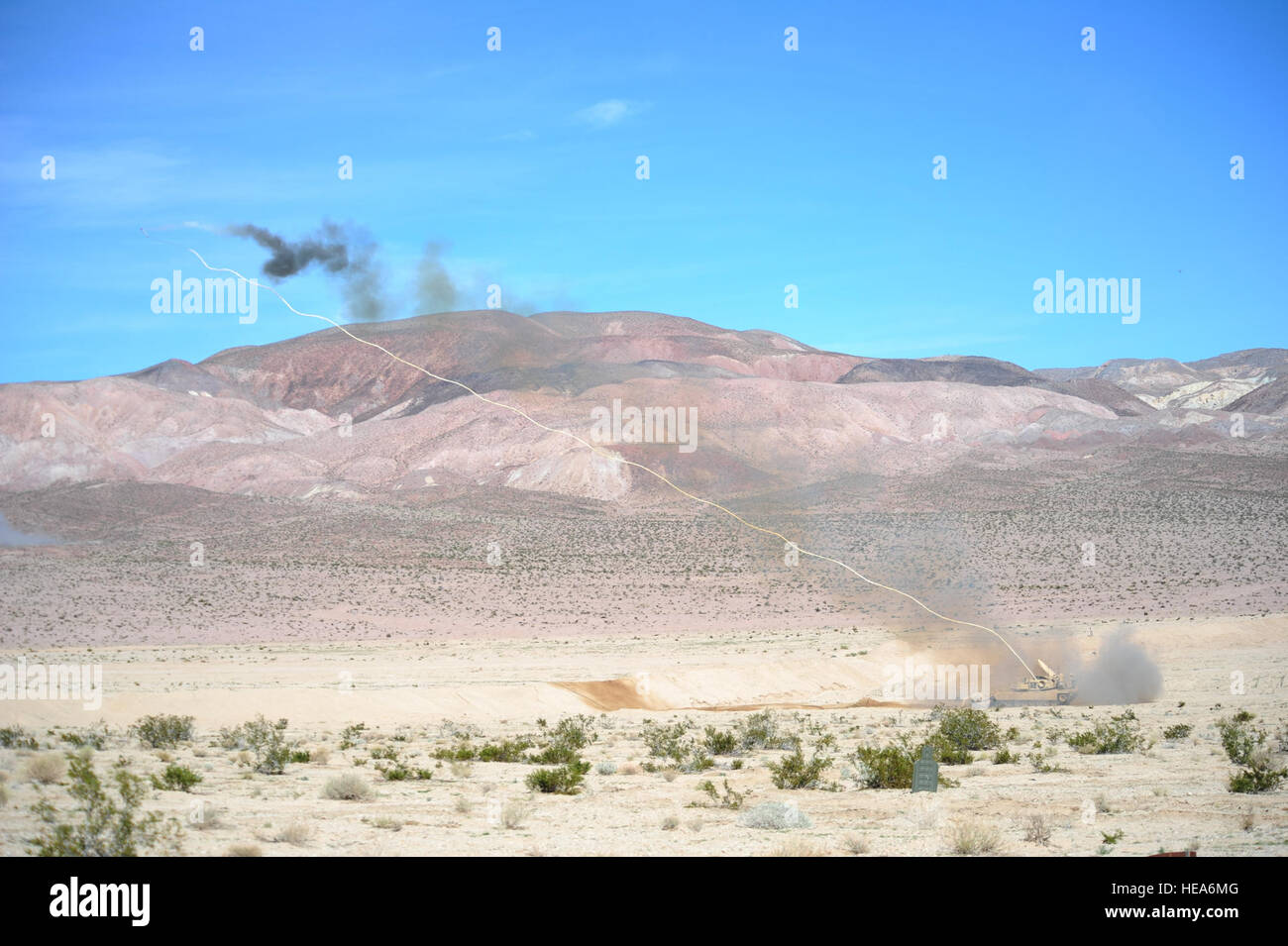 A U.S. Marine Corps M58 Mine Clearing Line Charge (MICLIC) fires a ...