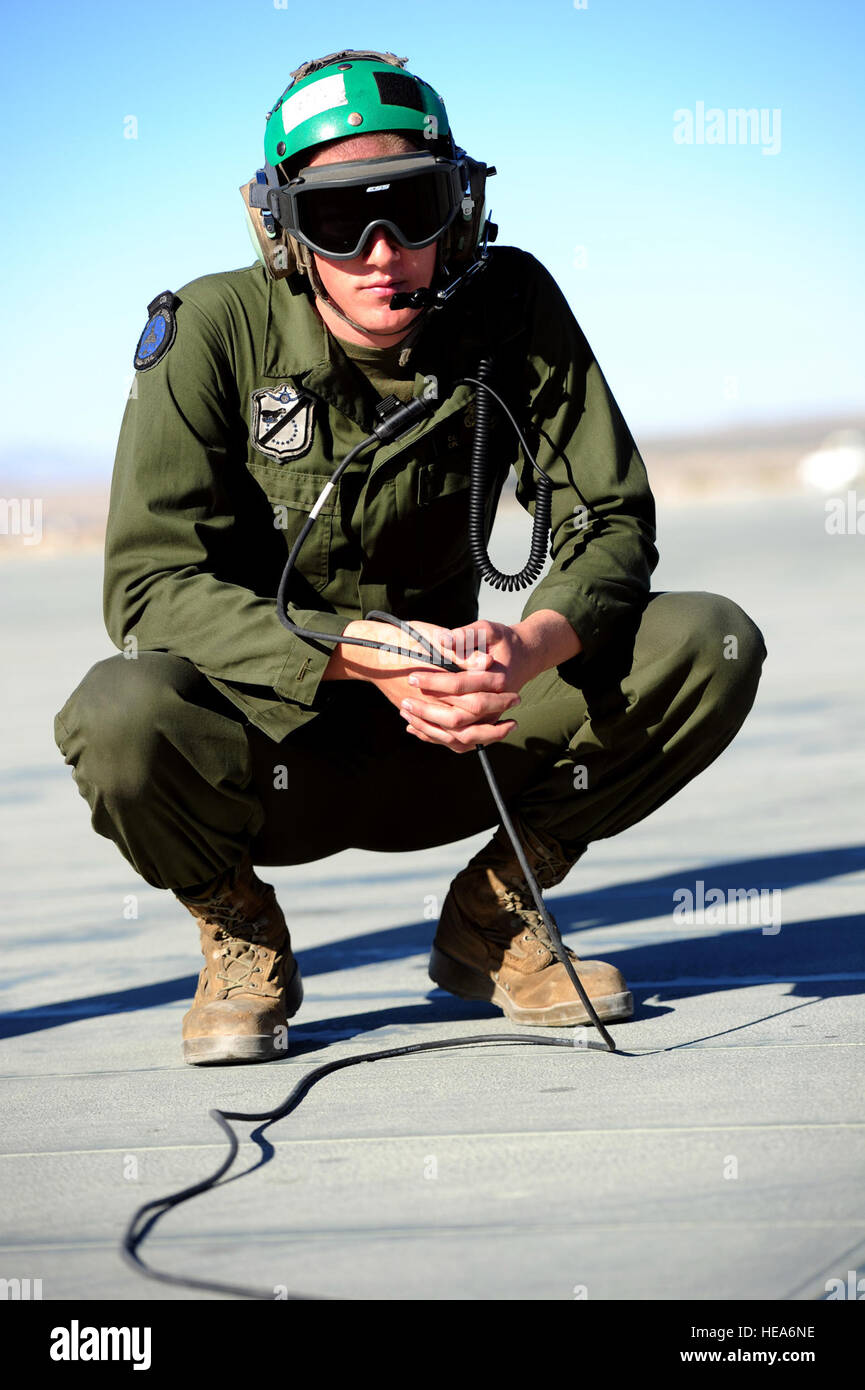 A U.S. Marine ground crew member from Marine Attack Squadron 214 ...
