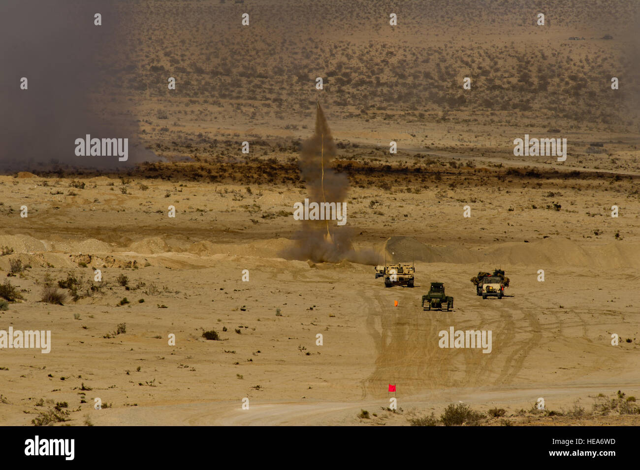 U.S. Marines deploy an M58 mine clearing line charge while ...