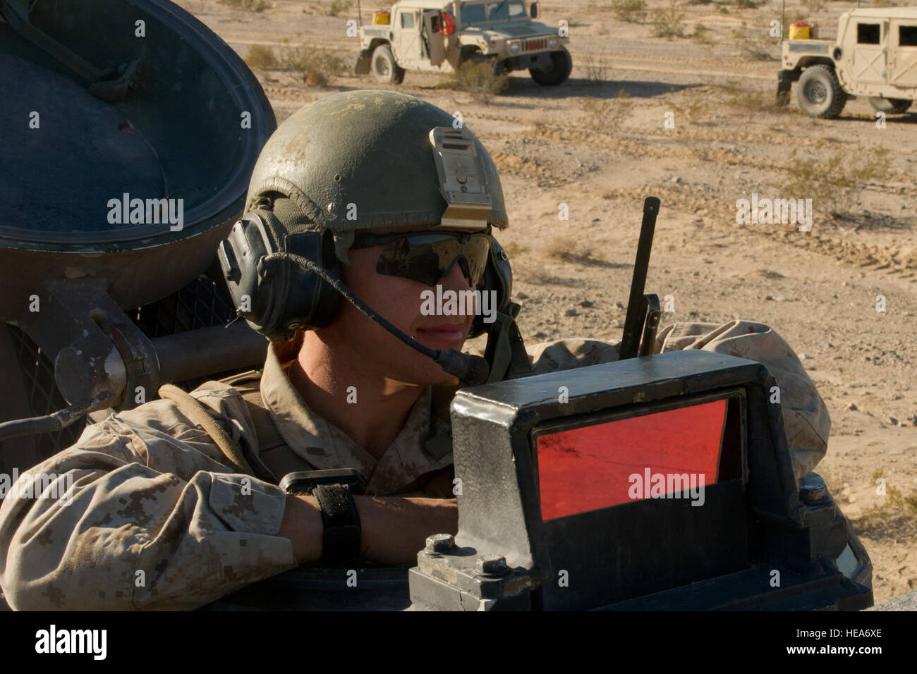 A U.S. Marine operates an assault amphibious vehicle during a ...