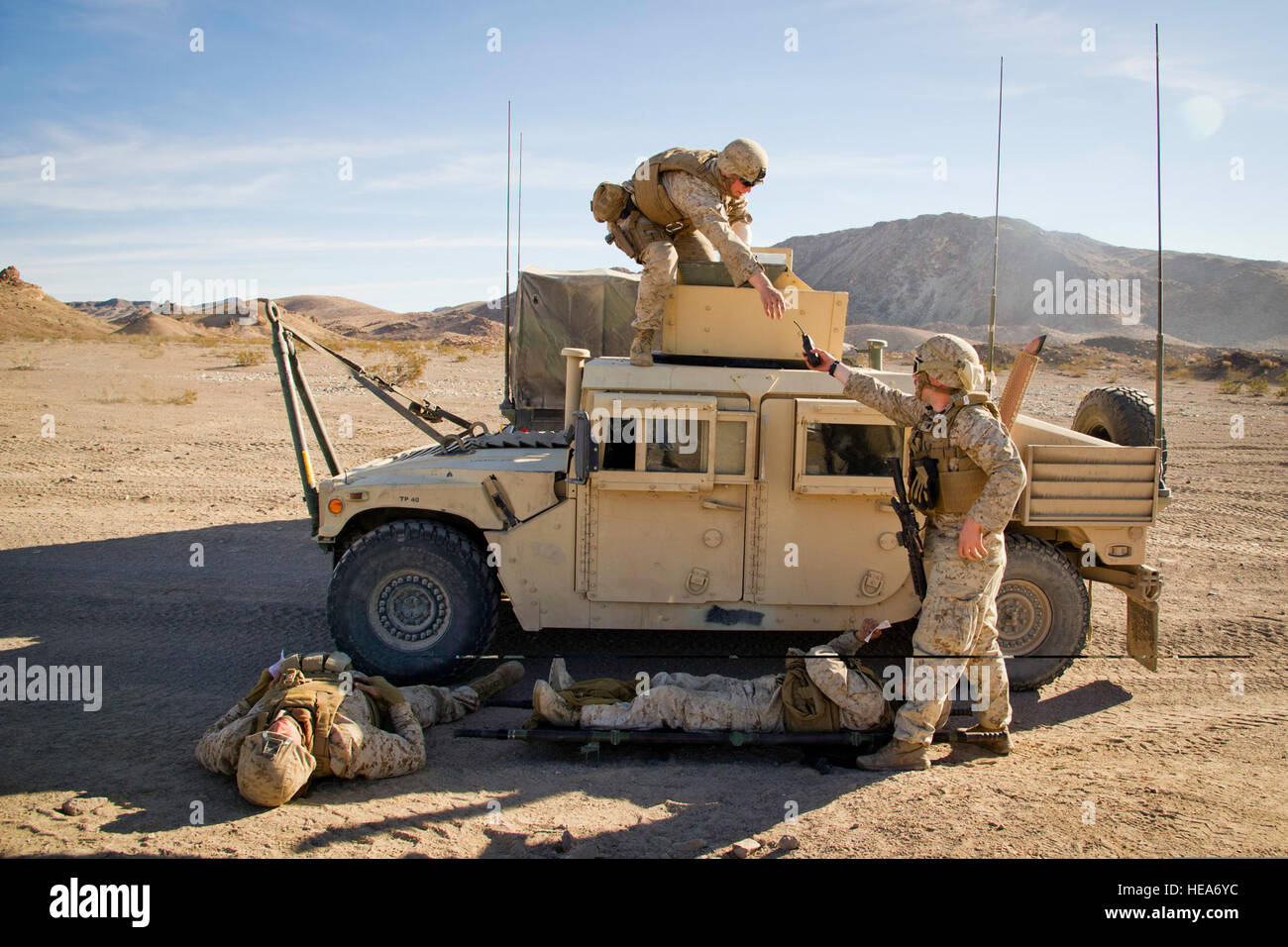 U.S. Marines and a U.S. Navy Hospitalman, all assigned to 1st Tank ...