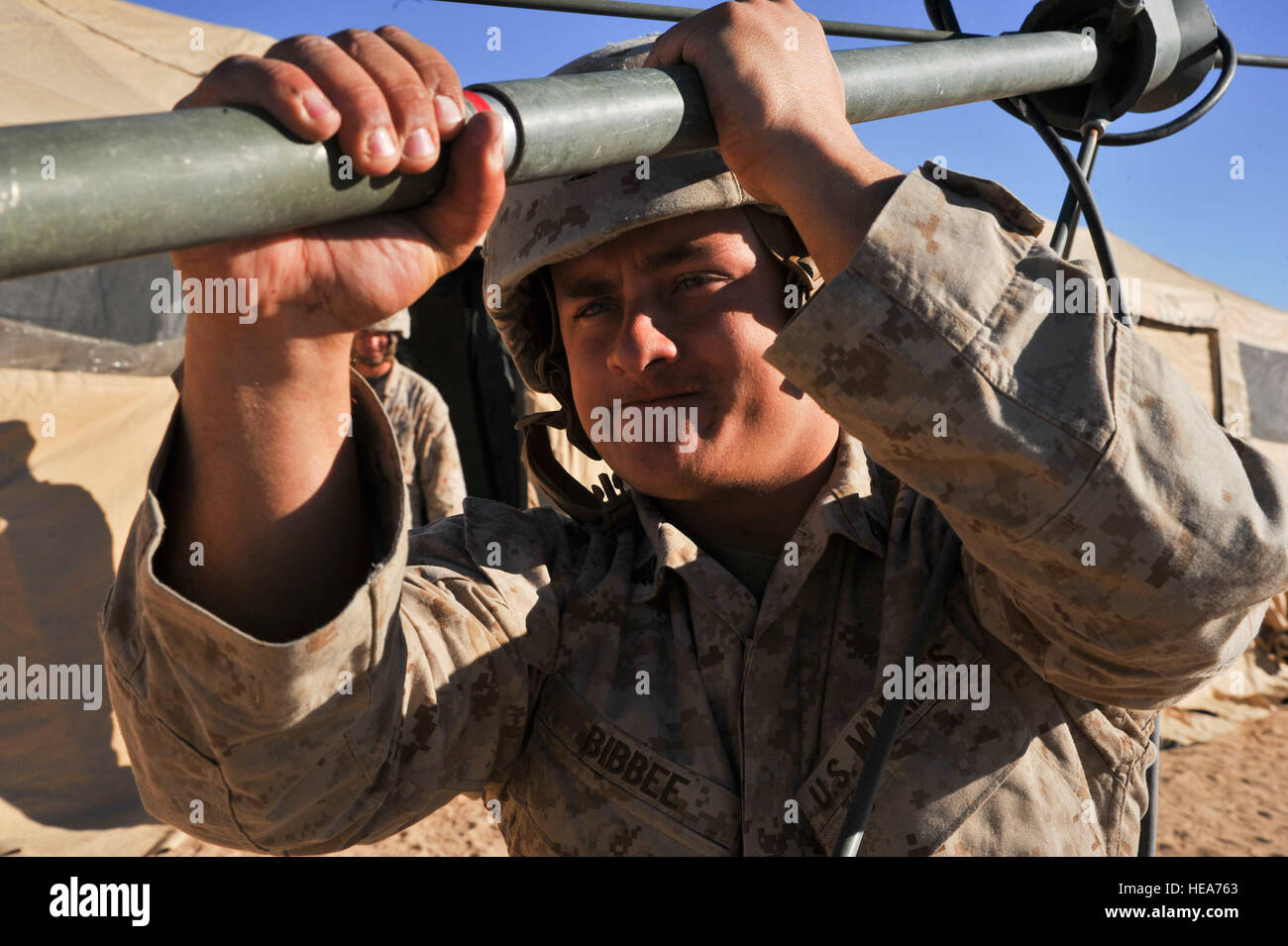 A Marine from Combat Logistics Battalion 13 sets up an OE-254 VHF ...