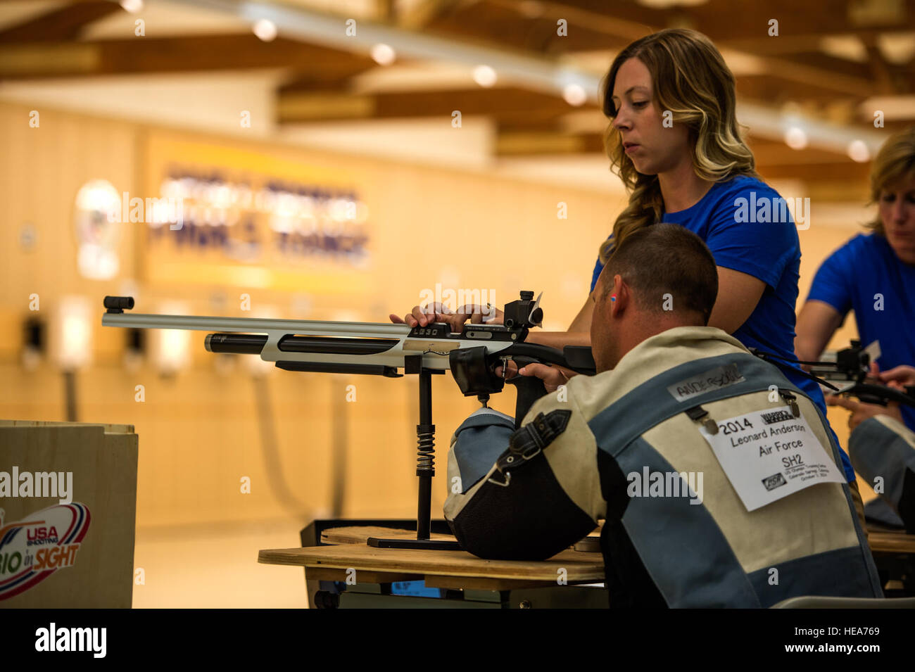 Georgia Jones reloads Air Force athlete Leonard Anderson's rifle while ...